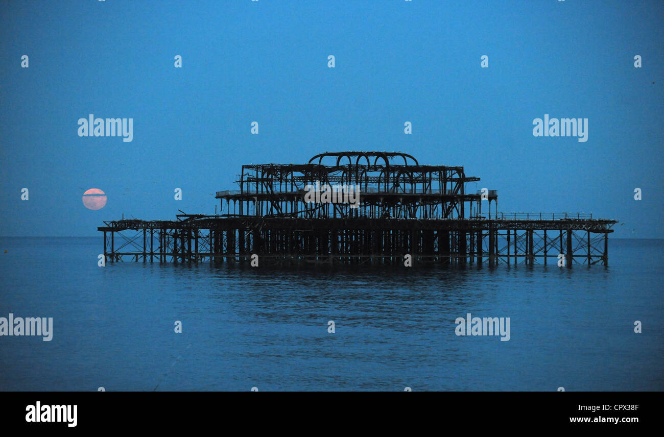 Brighton UK 4 June 2012 - A full moon rises over the West Pier as the ...