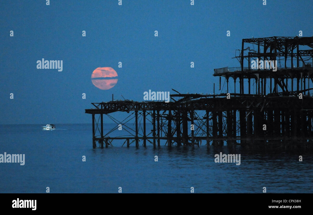 Brighton UK 4 June 2012 - A full moon rises over the West Pier as the ...