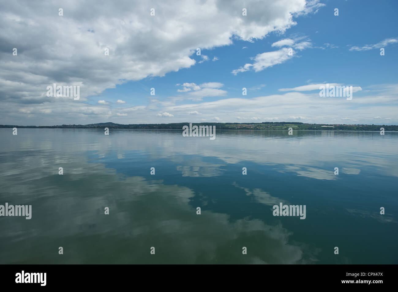 The Lake of Biel/Bienne in Stwitzerland. Clouds and an old tree hang ...