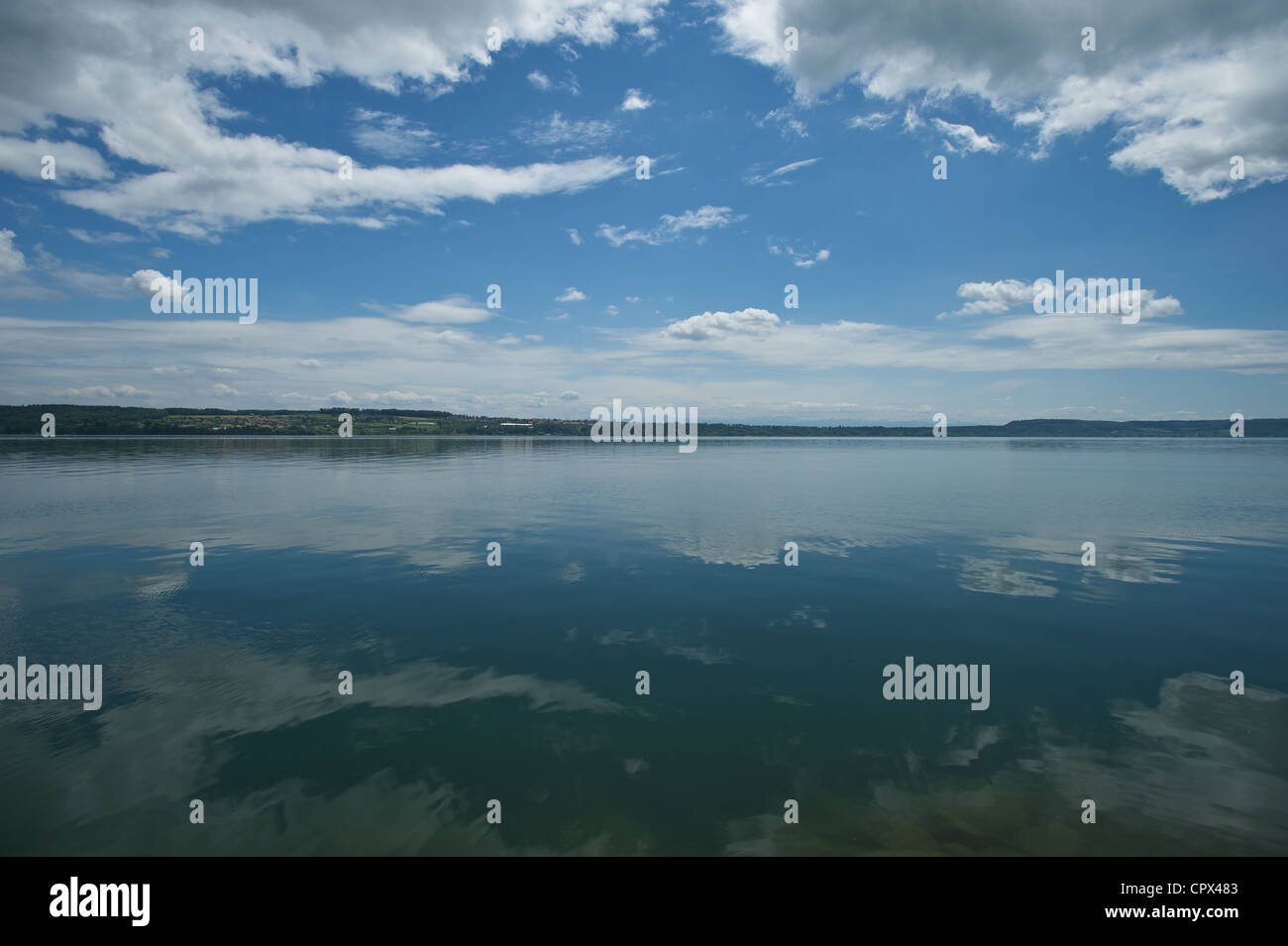 The Lake of Biel/Bienne in Stwitzerland. Clouds and an old tree hang ...
