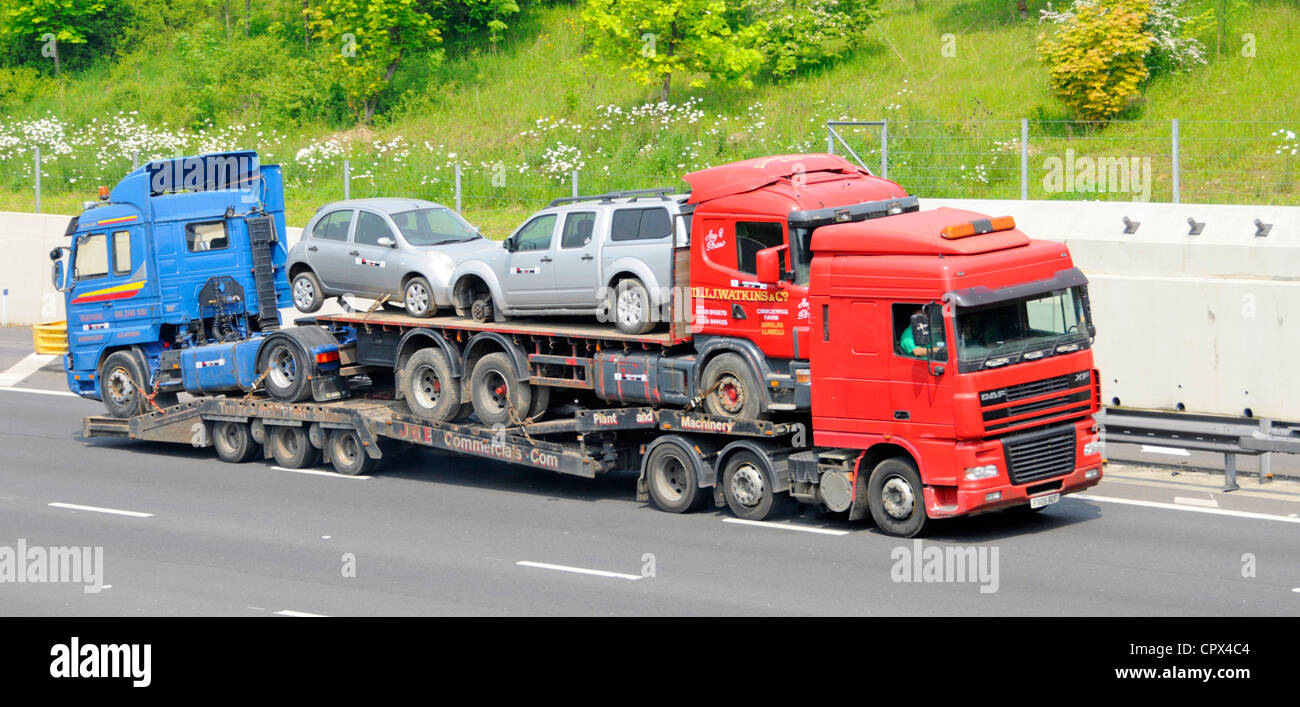 Lorry and low loader trailer carrying an unusual load of 4 assorted ...