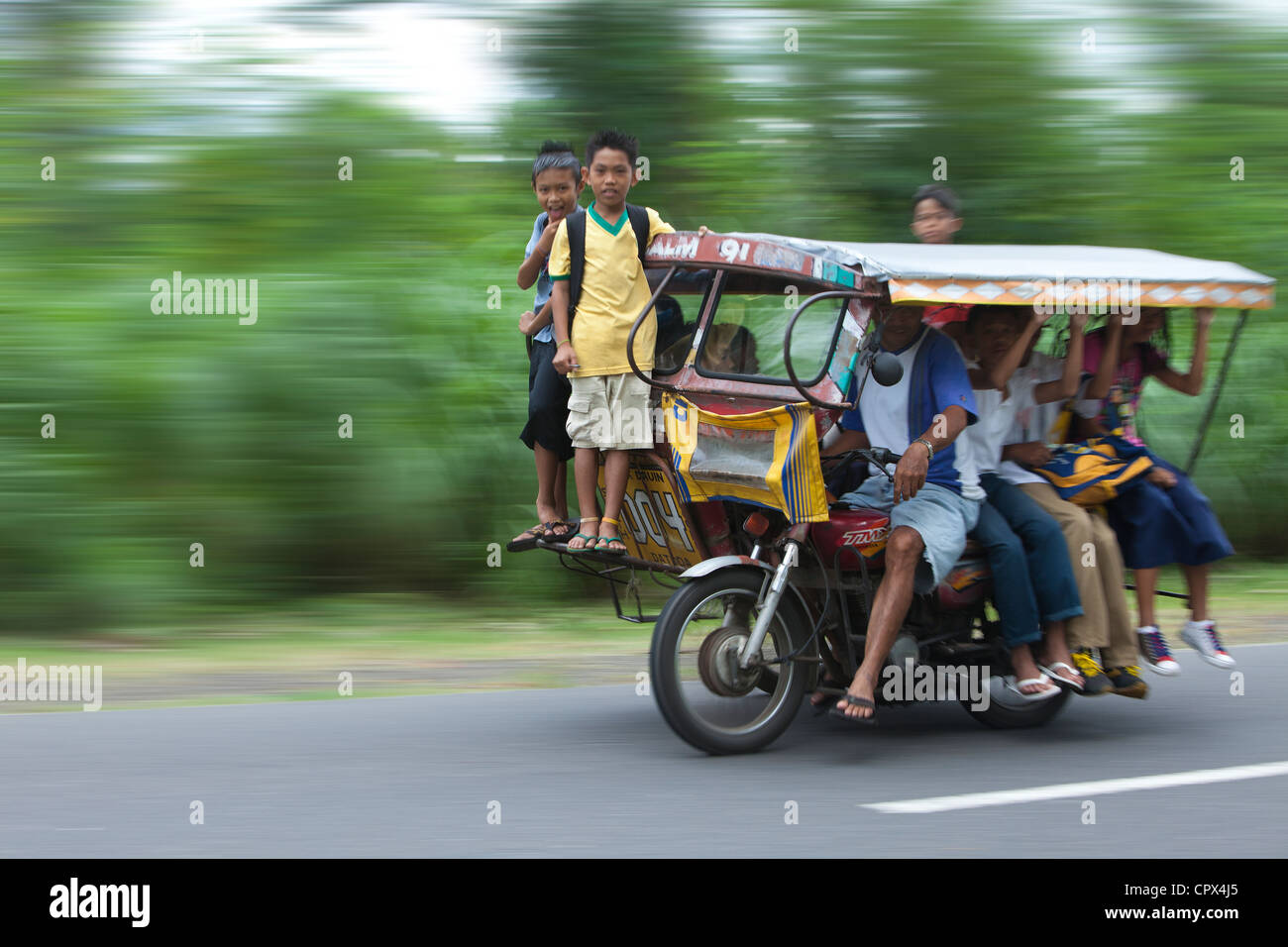an overloaded tricycle, Negros, Philippines Stock Photo, Royalty Free ...