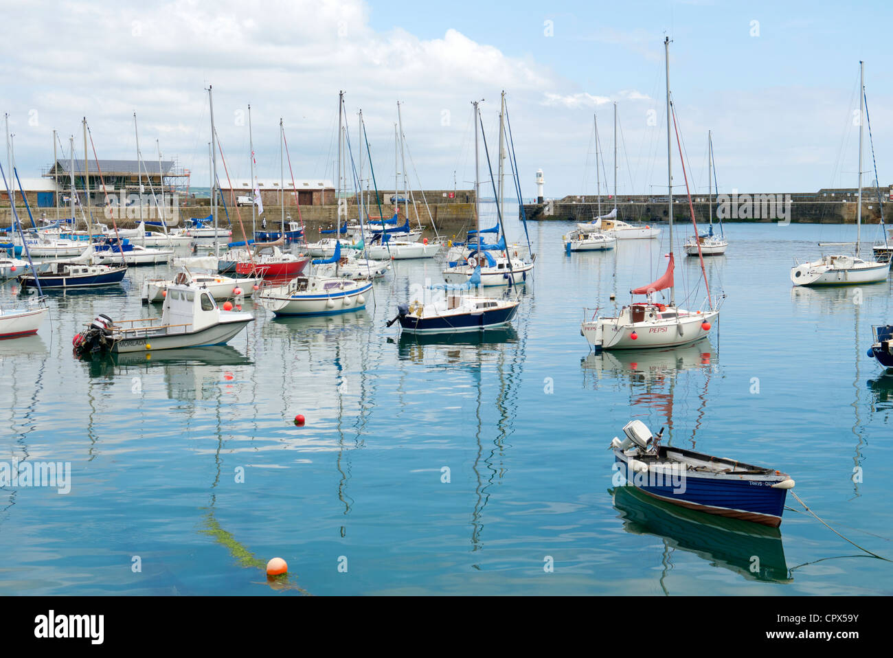 Penzance harbour boats calm still sea water reflections Stock Photo - Alamy