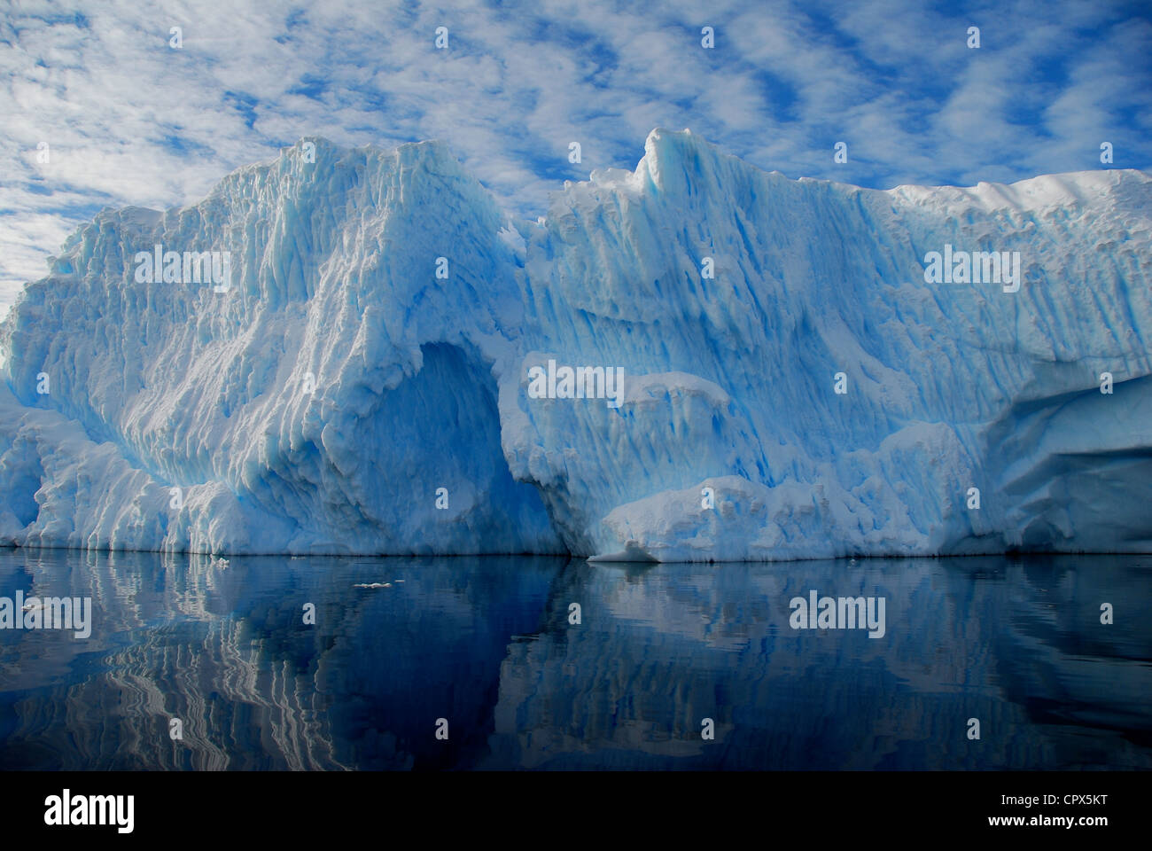 iceberg reflected in ocean Stock Photo - Alamy