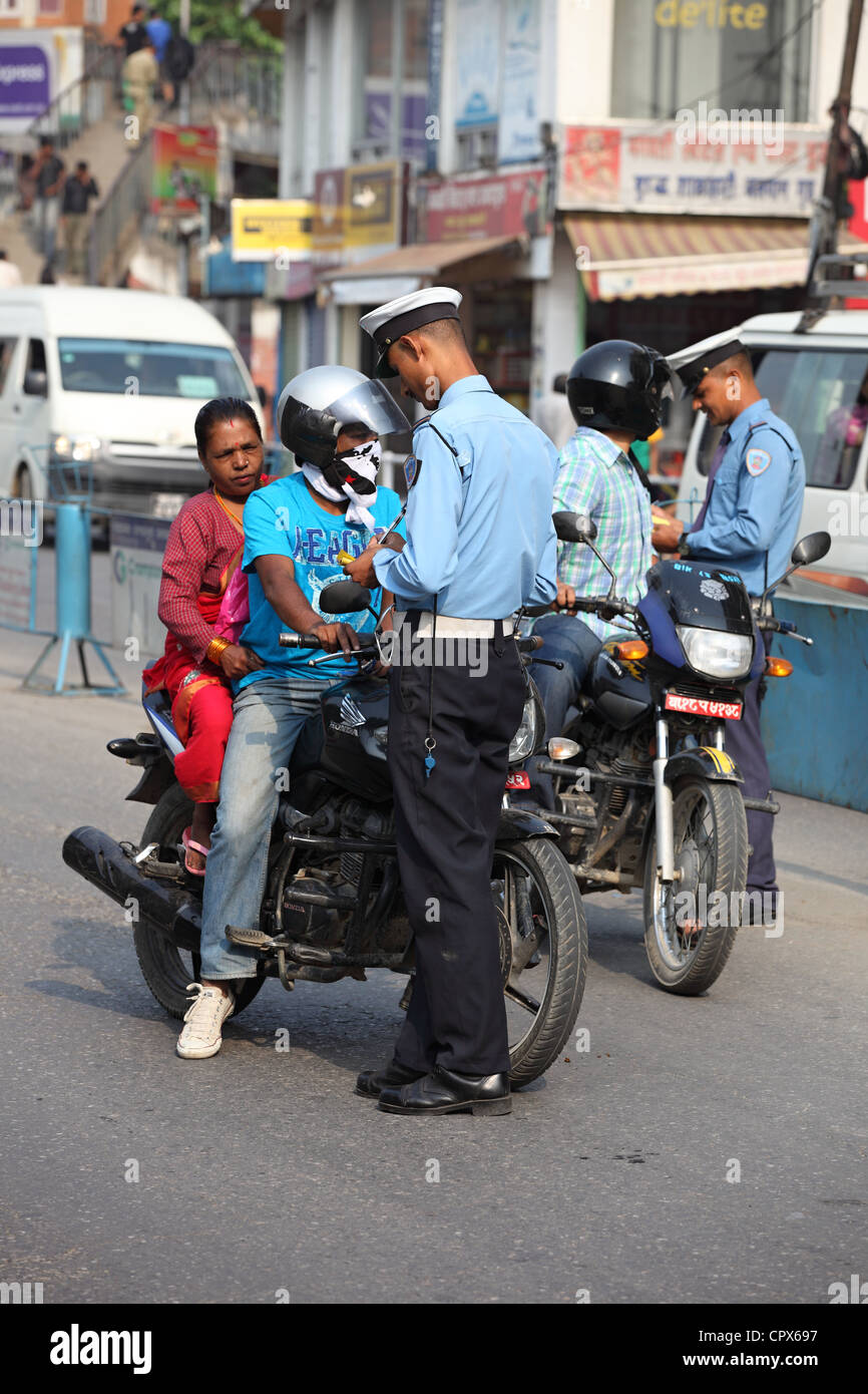 Police officer controlling a motorbike Nepal Stock Photo - Alamy