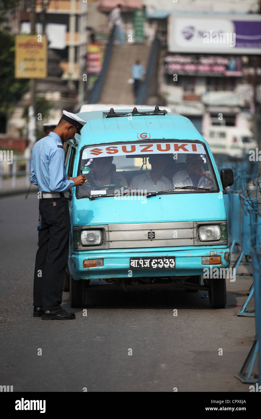 Police officer controlling a vehicle Nepal Stock Photo - Alamy