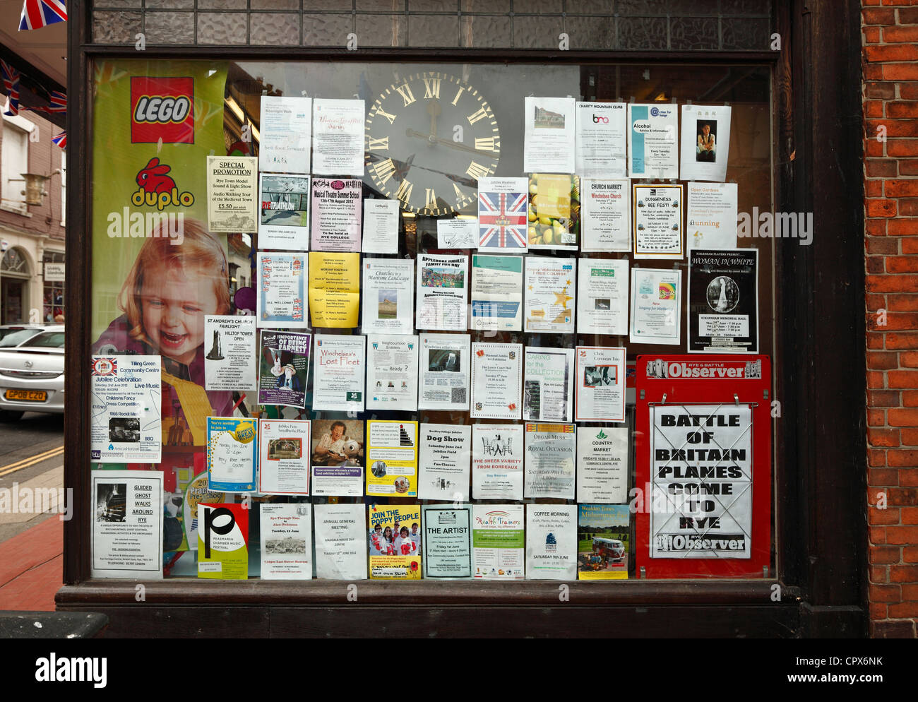 Shop window covered in notices Stock Photo - Alamy