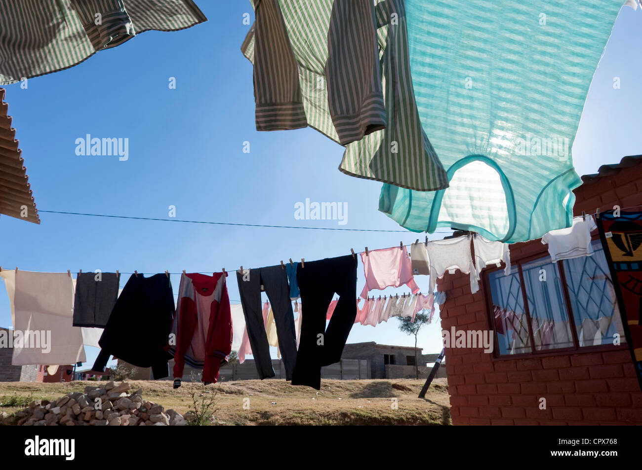 Washing lines hanging from the side of a house Stock Photo - Alamy