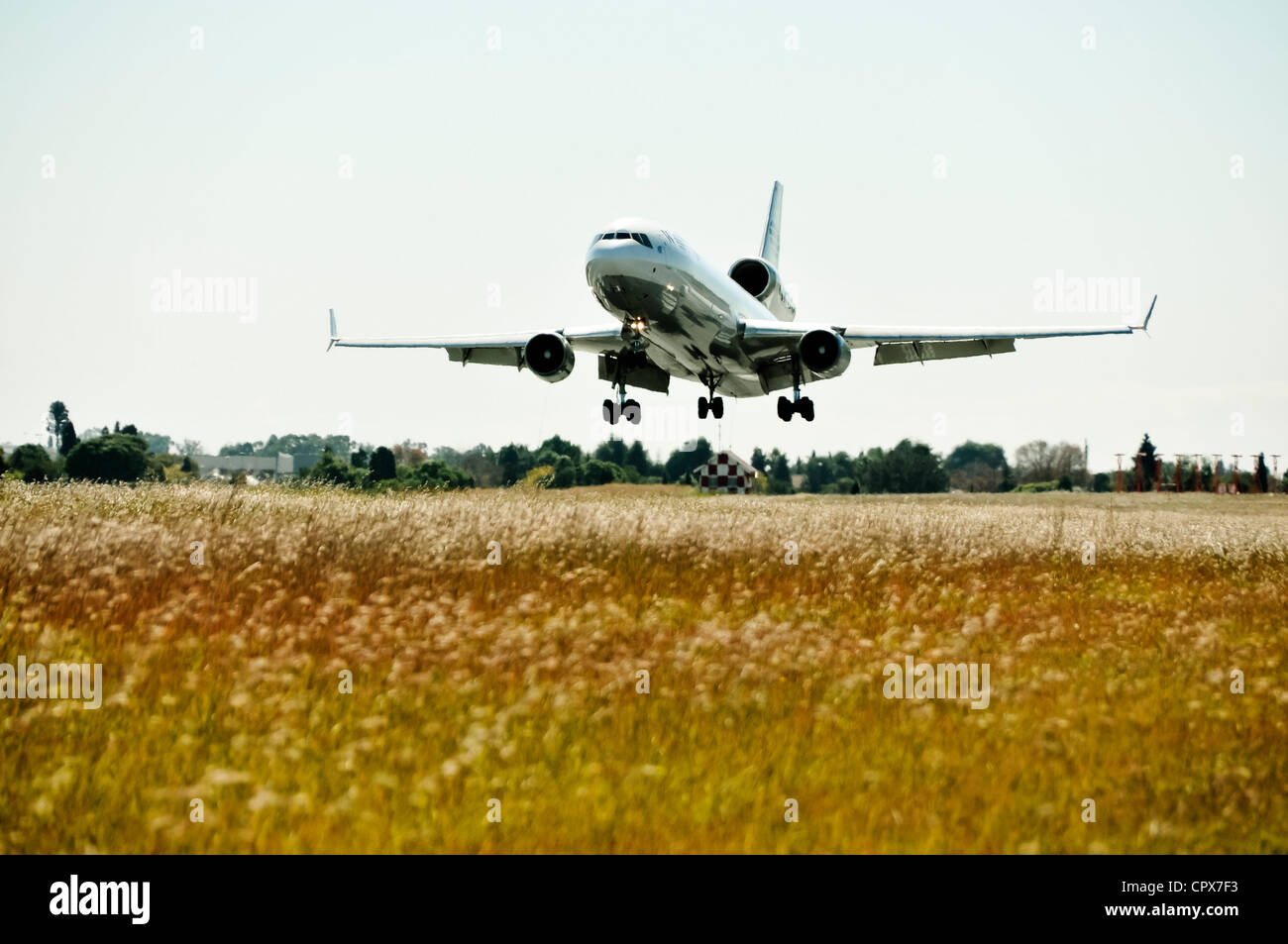 Airplane taking off from runway Stock Photo - Alamy