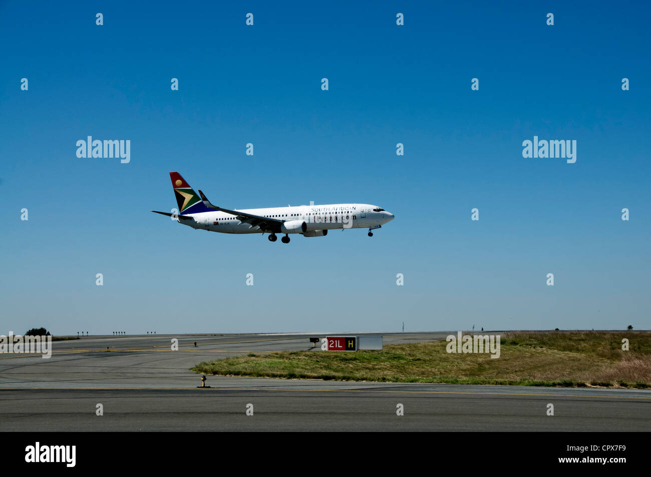 Airplane taking off from runway Stock Photo - Alamy