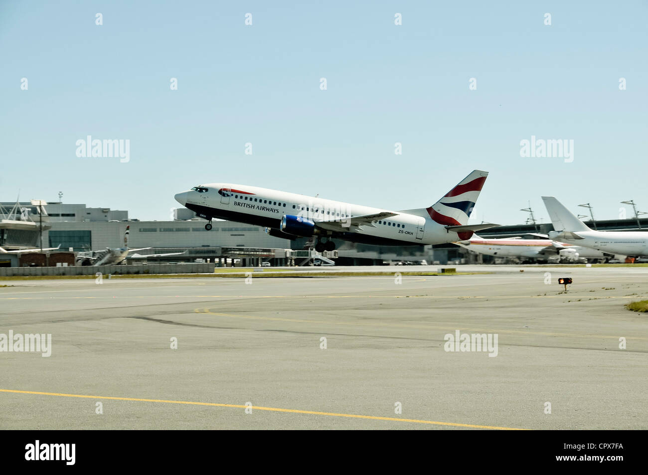 Airplane taking off from runway Stock Photo - Alamy