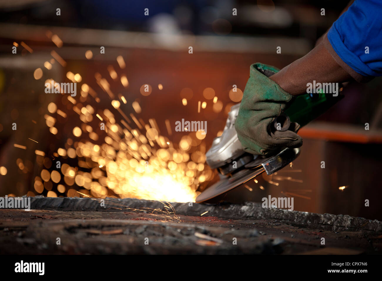 Grinding an industrial magnet in a magnet factory, Gauteng, South ...
