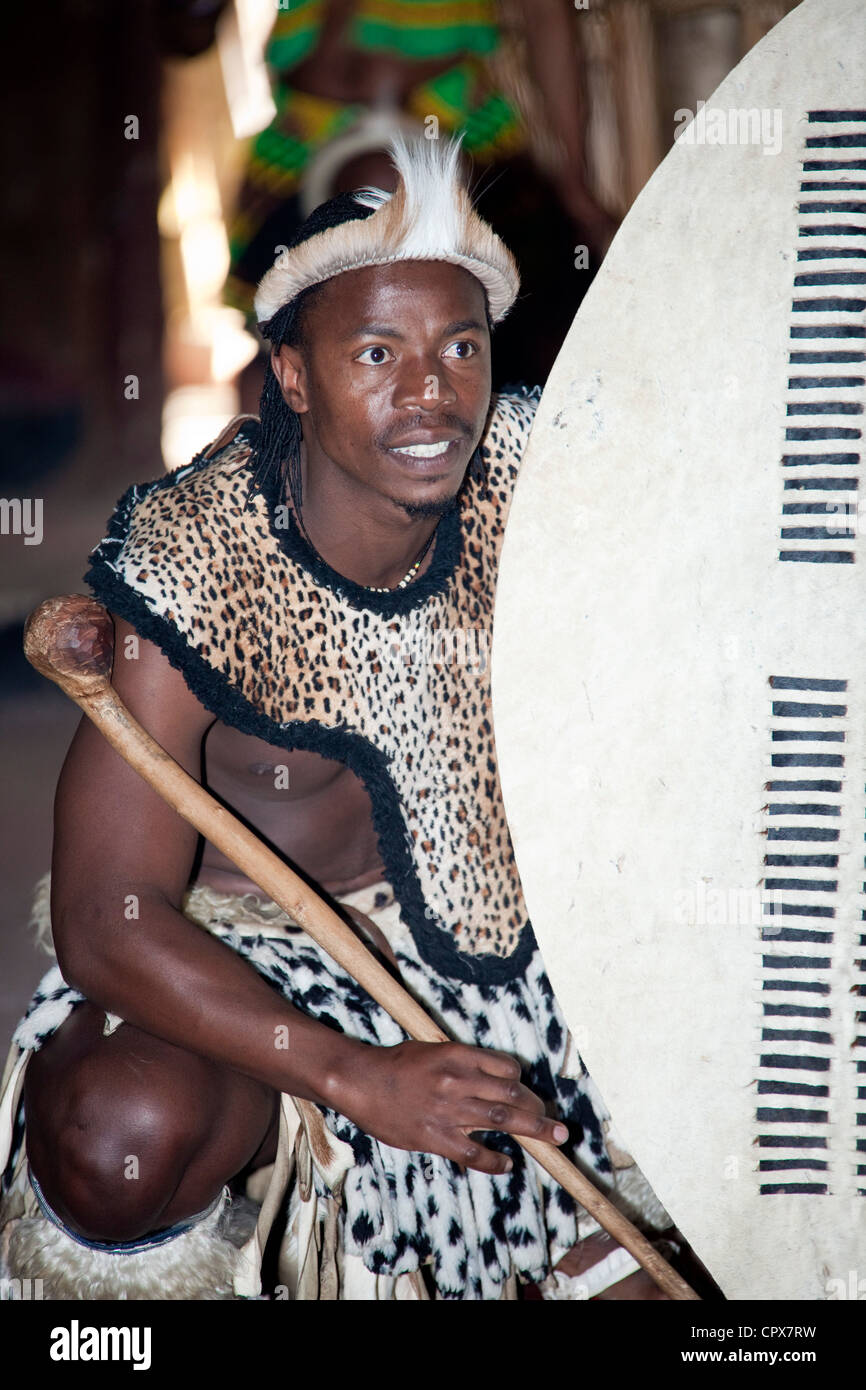 A male African traditional dancer kneeling on the floor Stock Photo - Alamy