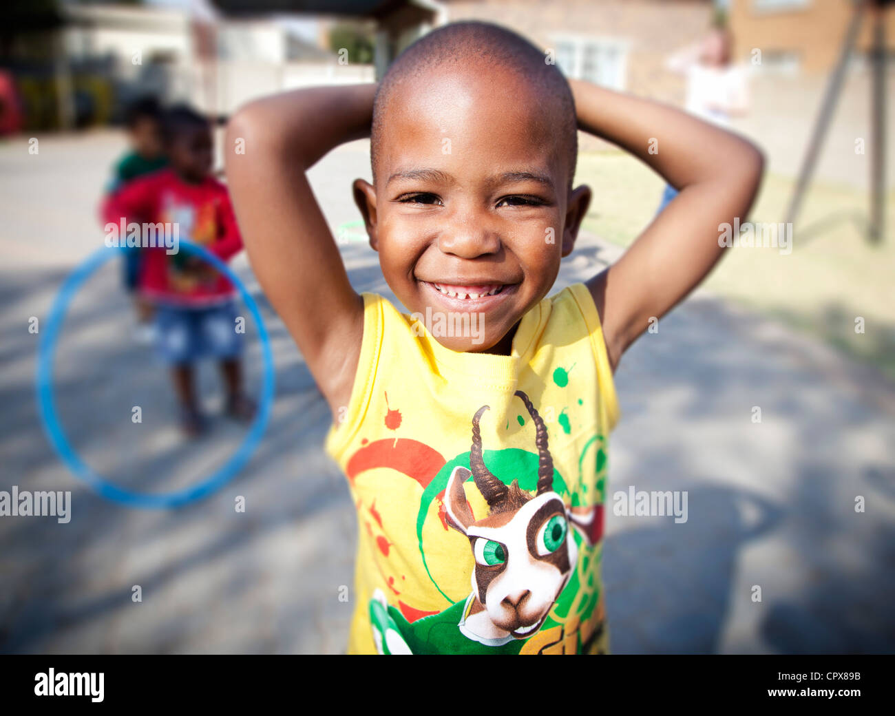Child standing alone in playground hi-res stock photography and images ...