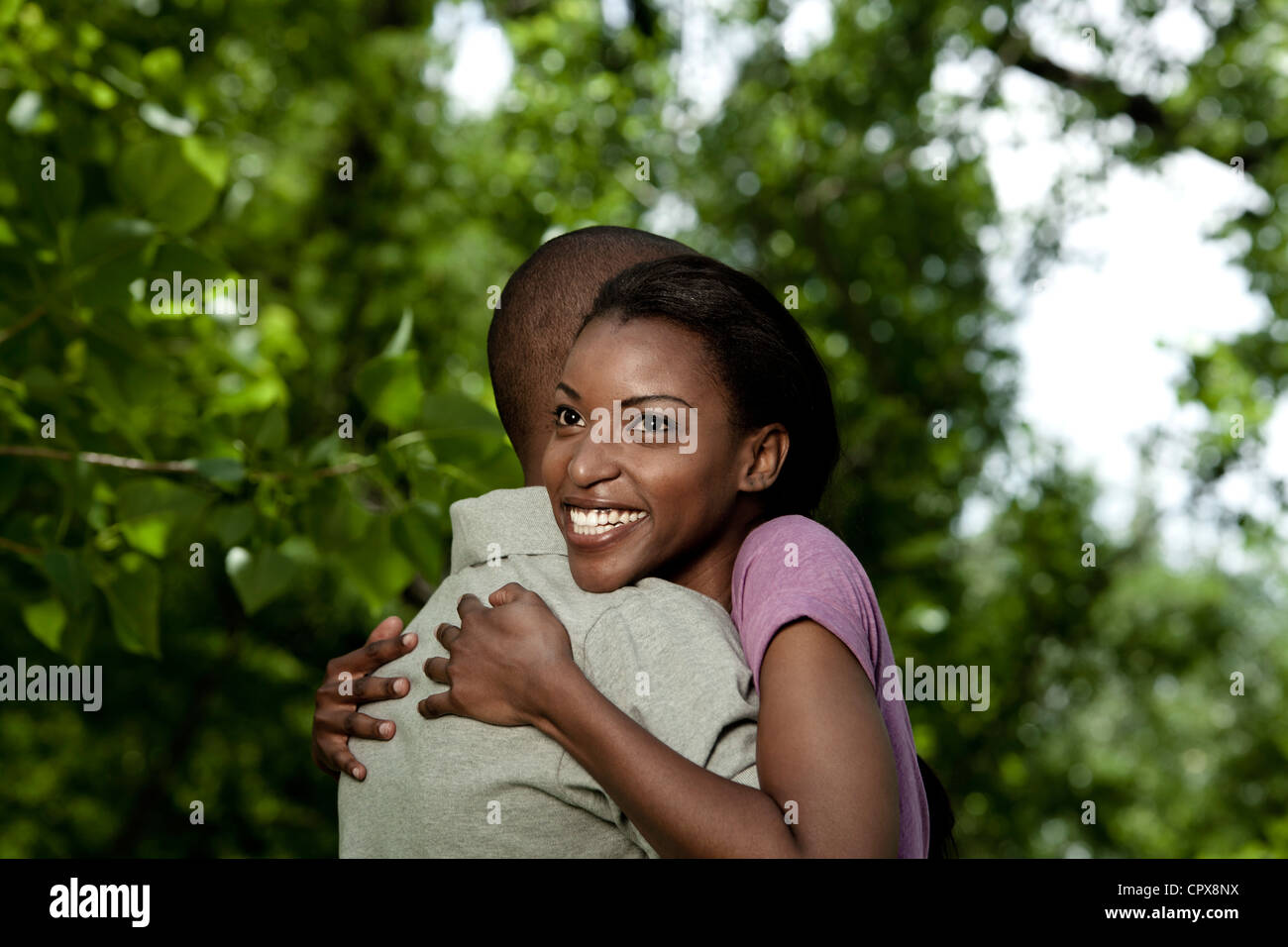 Closeup portrait of a young black couple hugging Stock Photo - Alamy