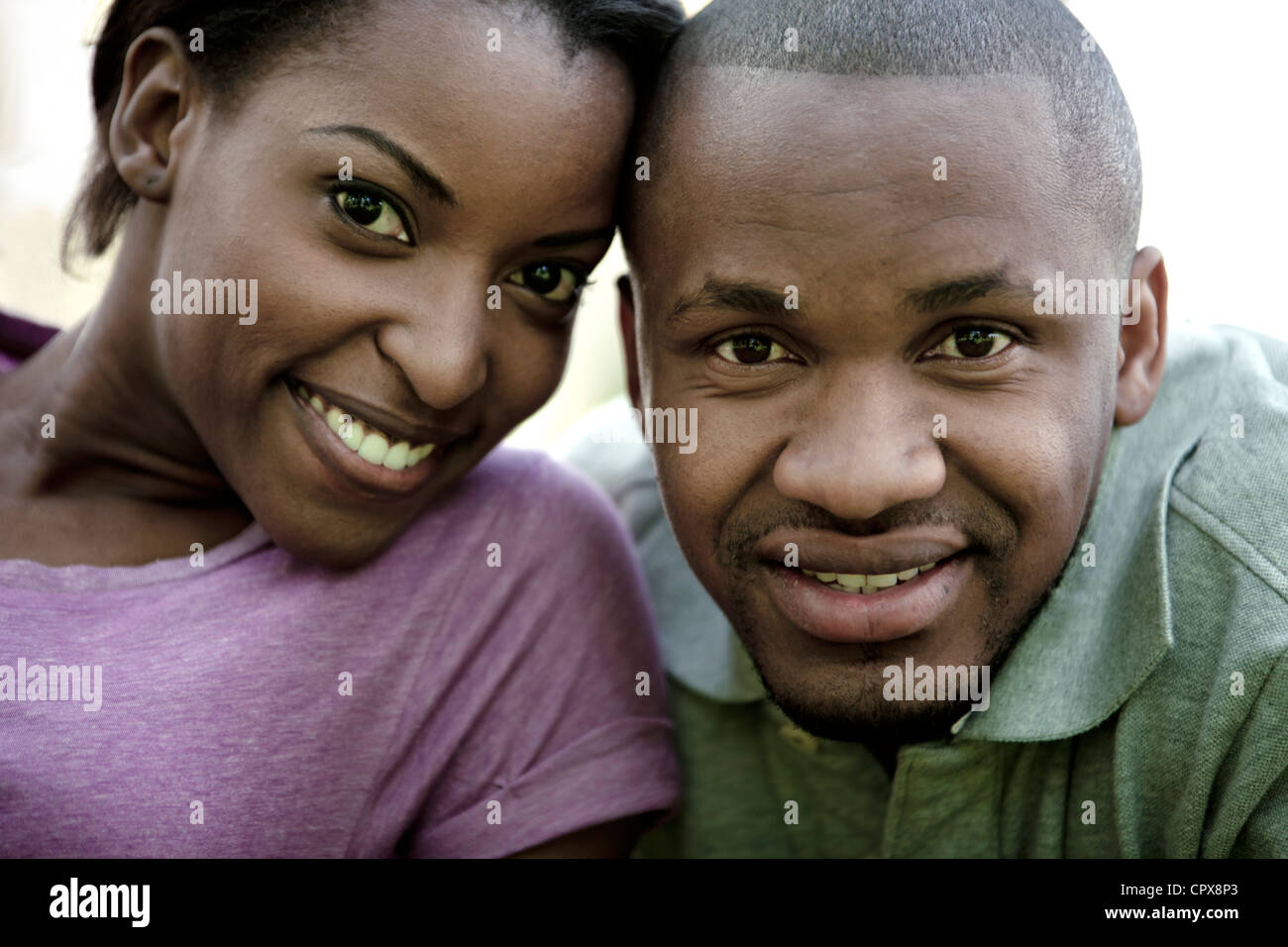 Closeup of a young black couple smiling at the camera Stock Photo - Alamy