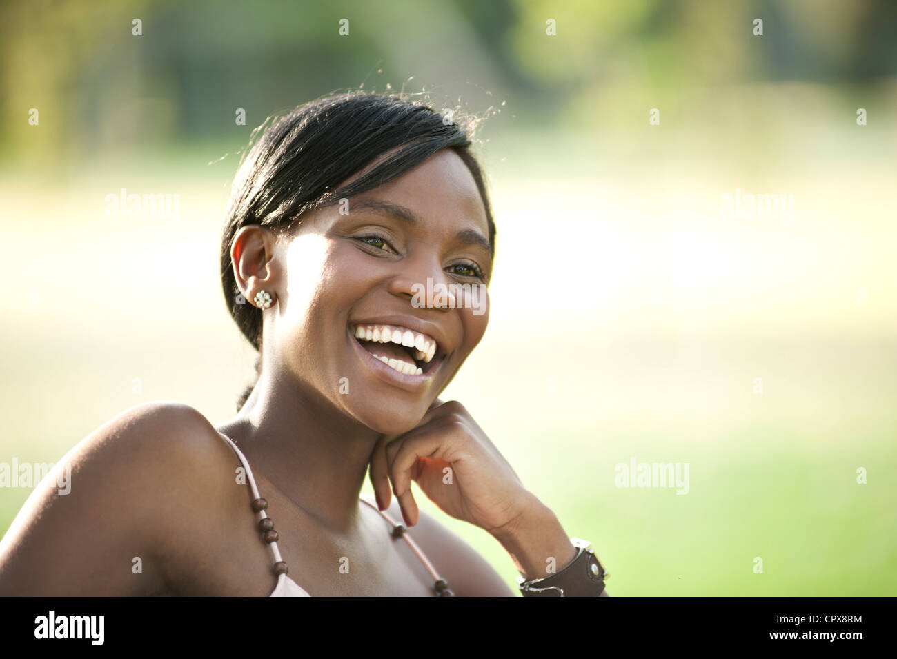 Portrait of a young African female smiling Stock Photo - Alamy
