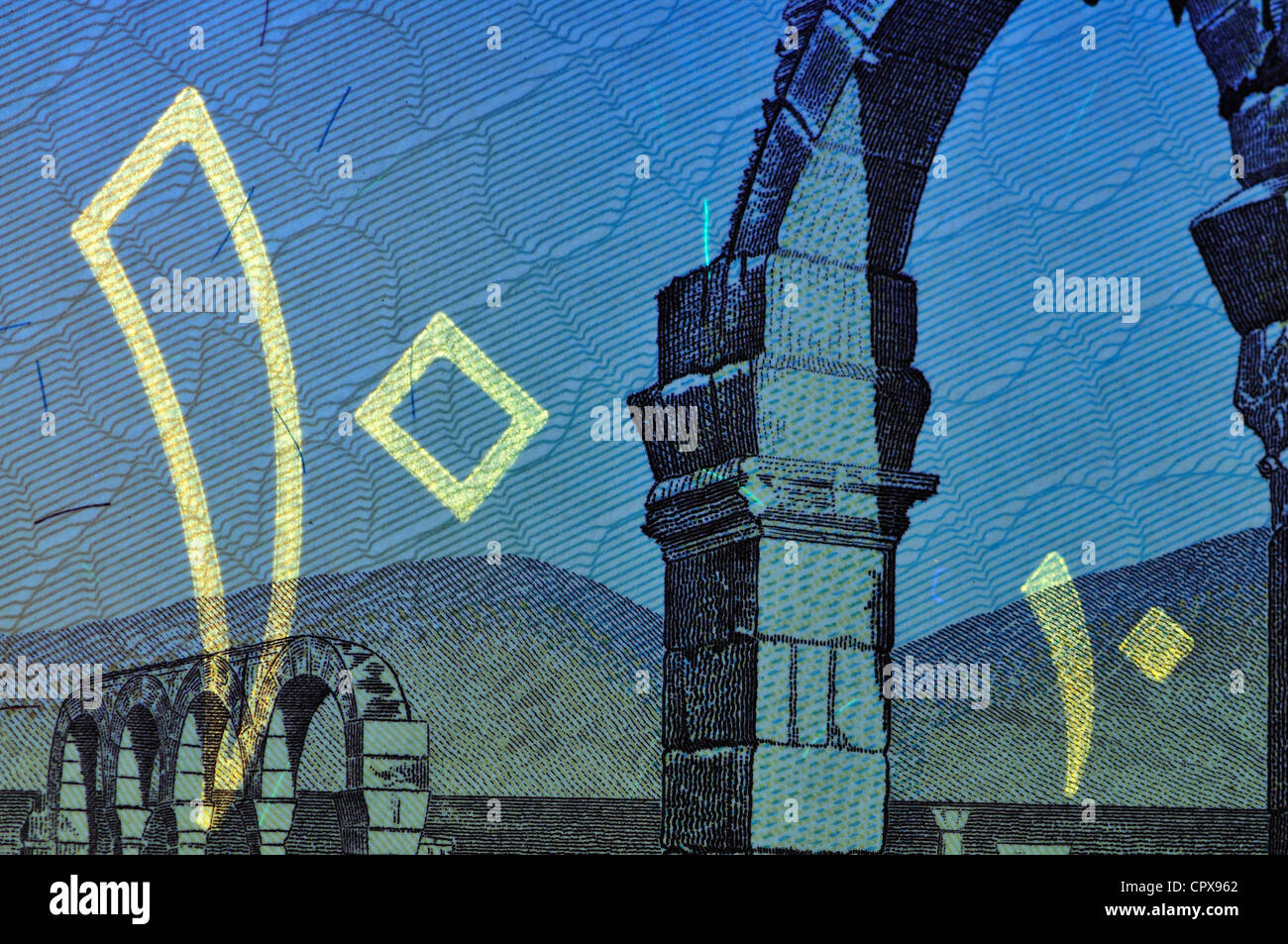 Banknote security features seen under ultraviolet light. Number 10 on ...