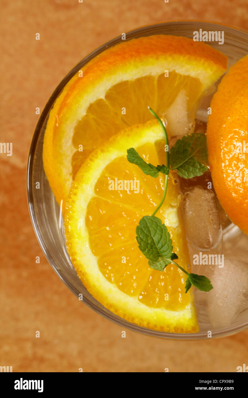 fresh orange lemonade with mint leaves and ice Stock Photo - Alamy