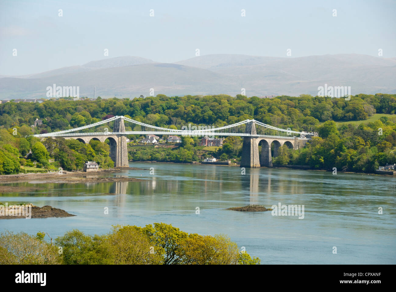 The Menai Bridge spanning the Menai Strait between Anglesey and the ...