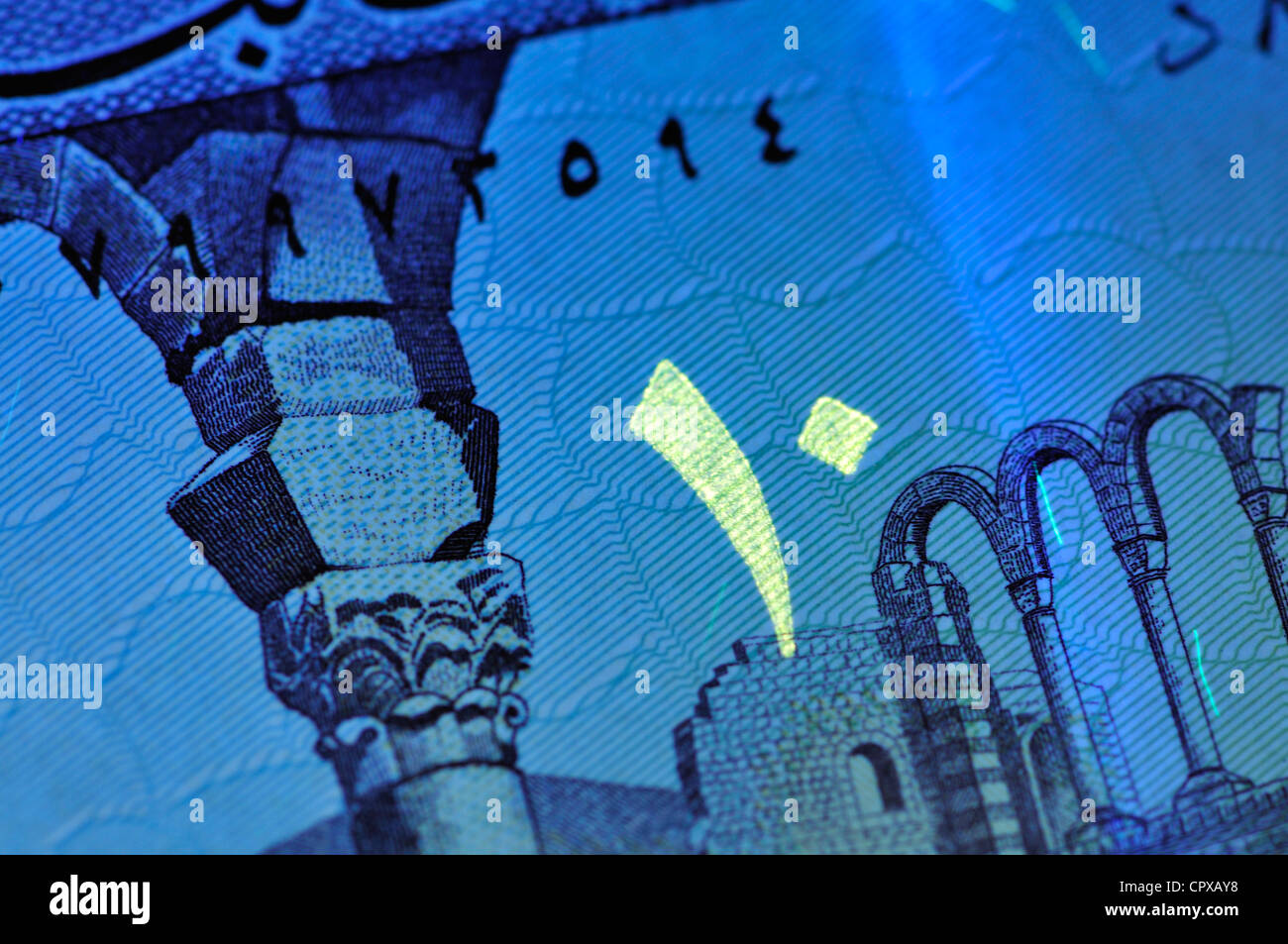 Banknote security features seen under ultraviolet light. Number 10 on ...