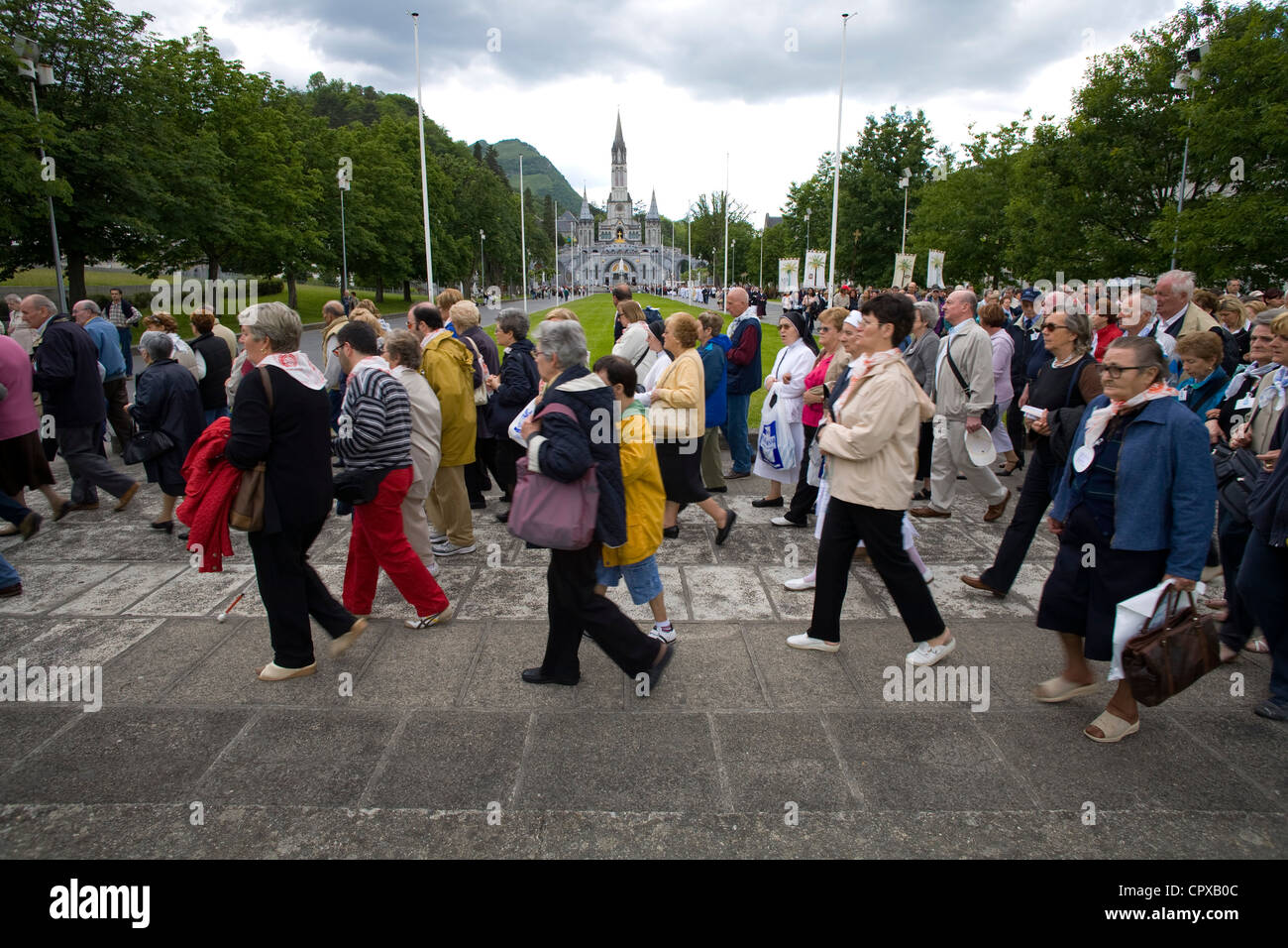 Christian pilgrims march outside the Rosary Basilica, Lourdes, Midi ...