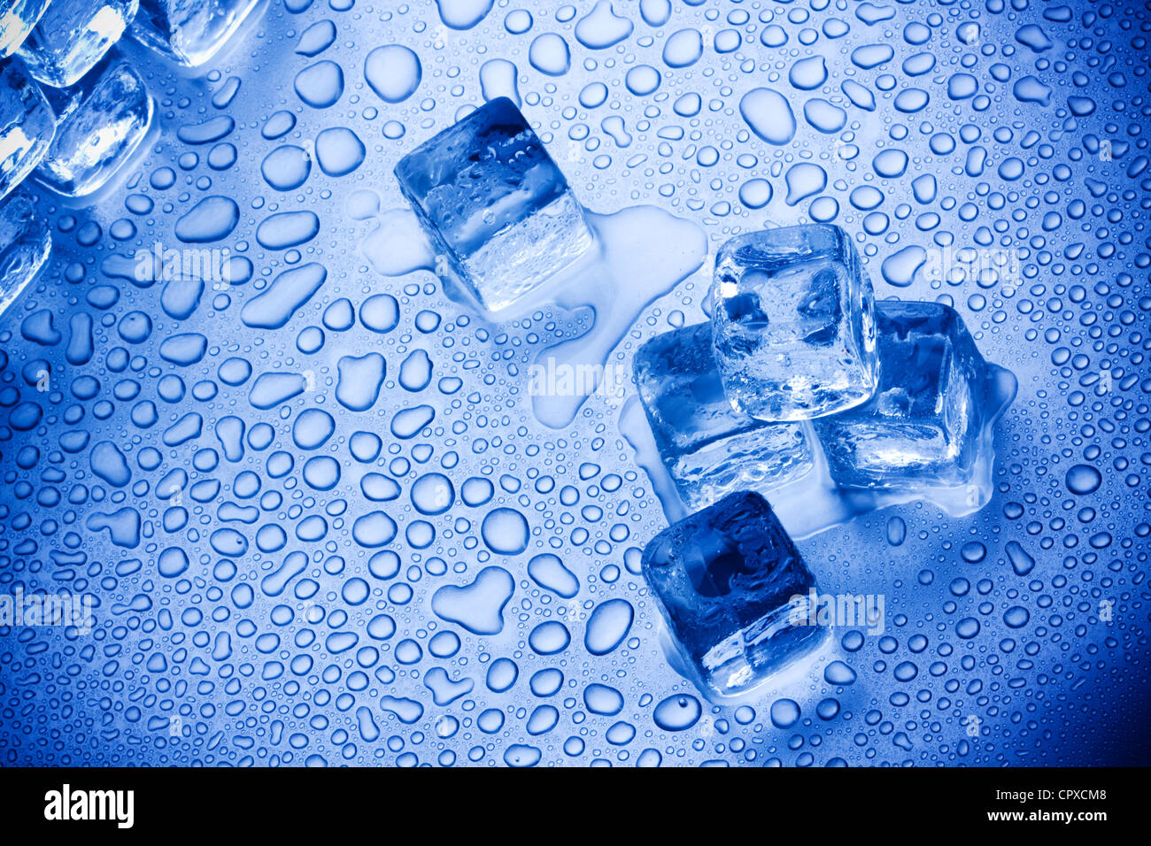 ice cubes in blue background Stock Photo - Alamy