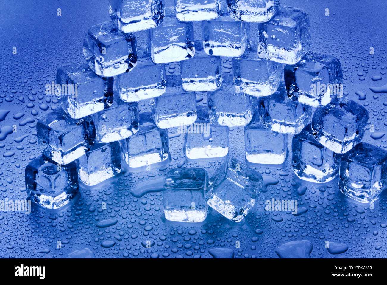 ice cubes in blue background Stock Photo - Alamy