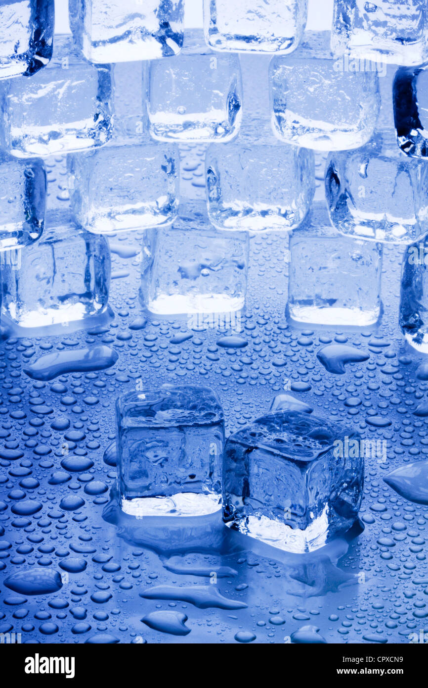 ice cubes in blue background Stock Photo - Alamy