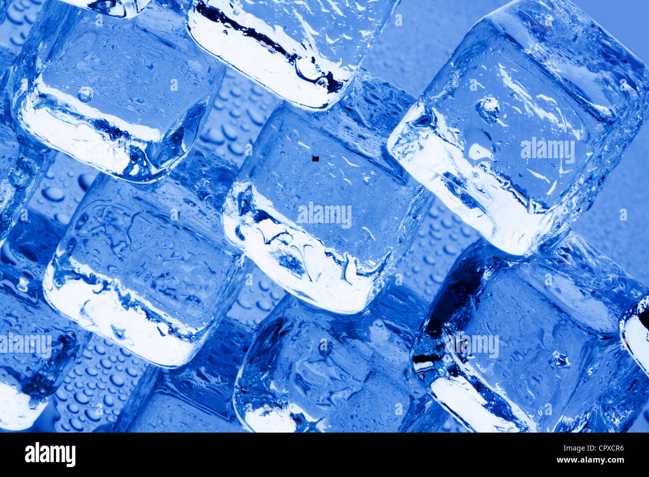 ice cubes in blue background Stock Photo - Alamy