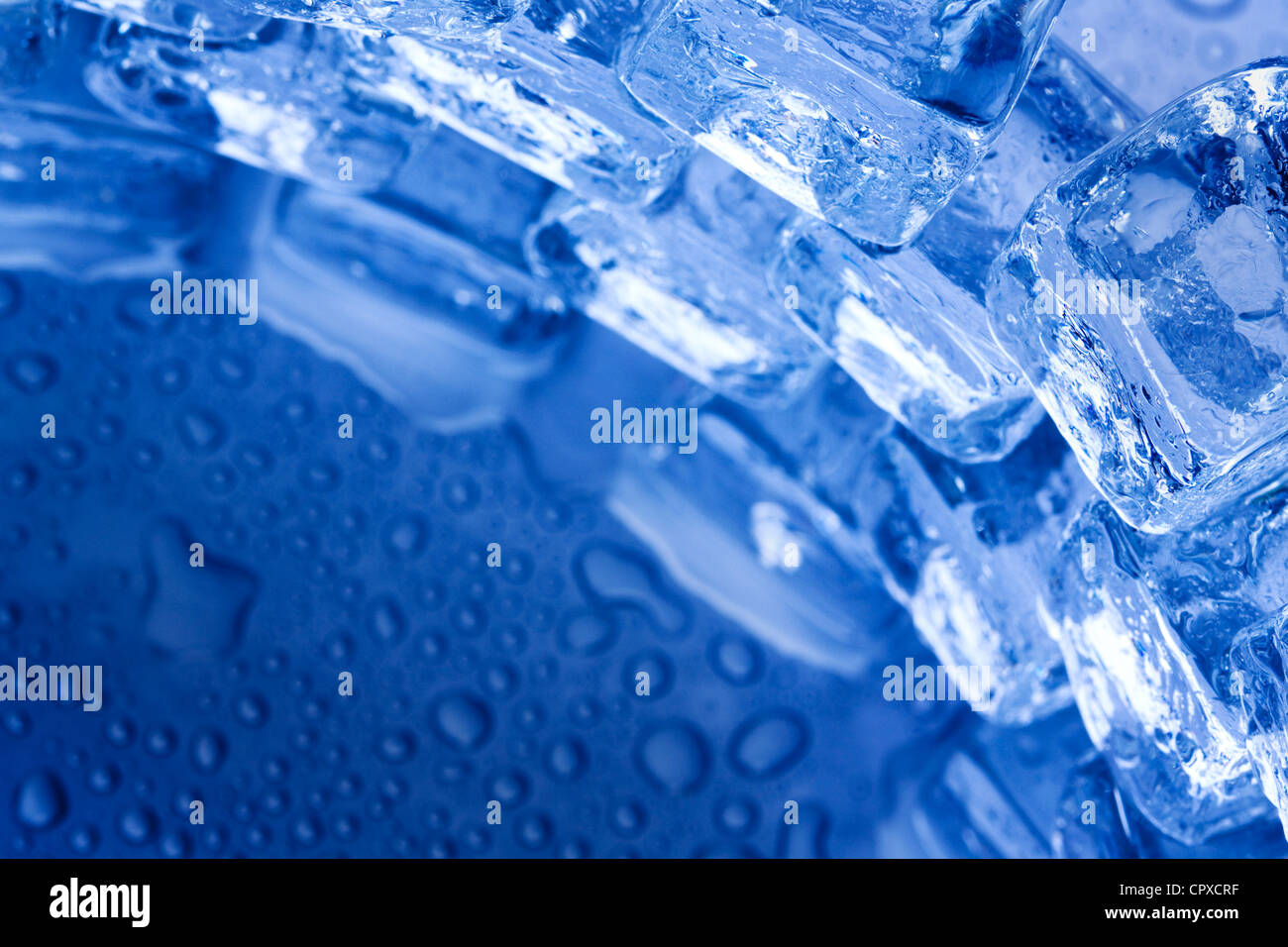 ice cubes in blue background Stock Photo - Alamy
