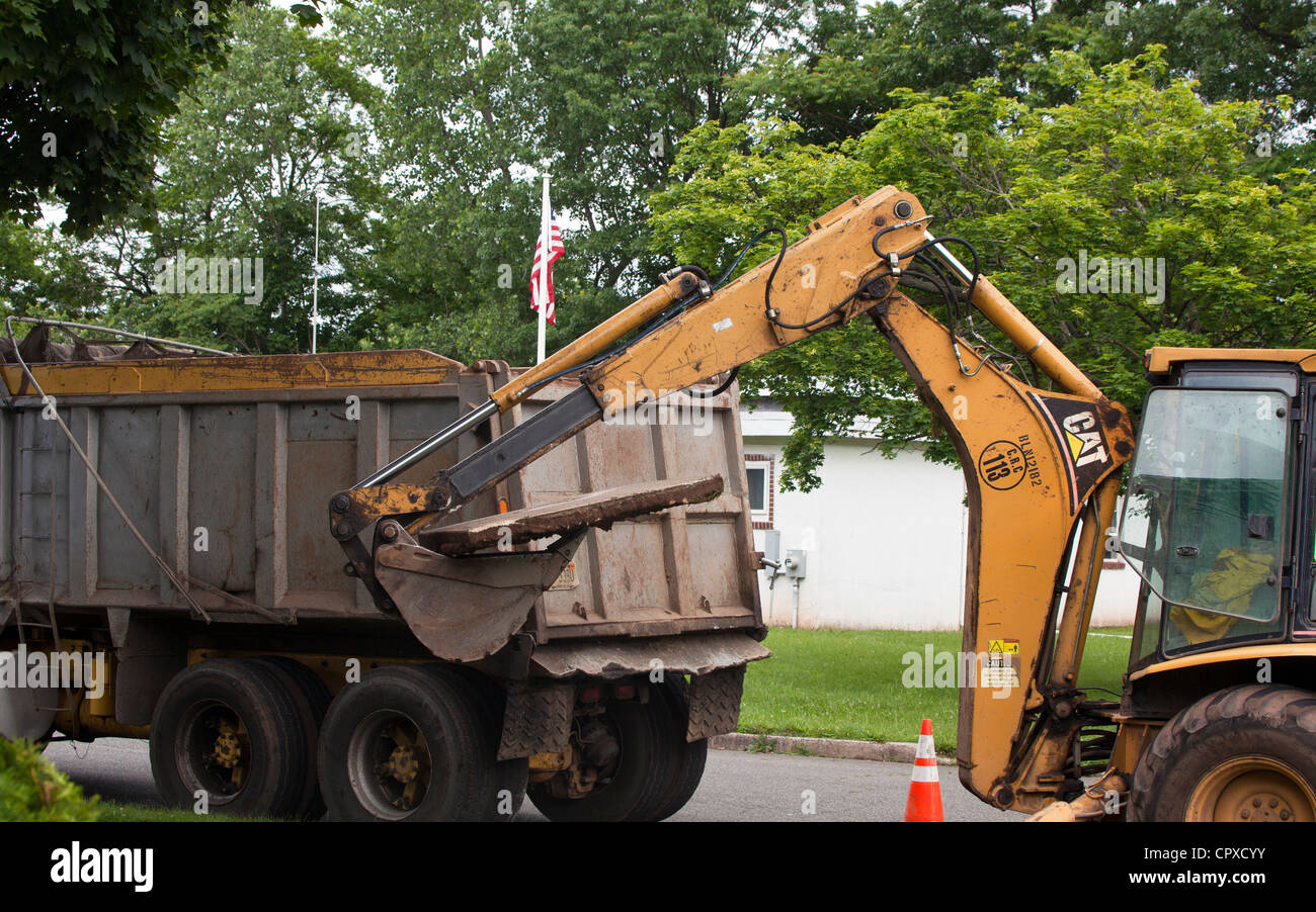 Backhoe, truck, lorry sidewalk construction repair work Stock Photo - Alamy