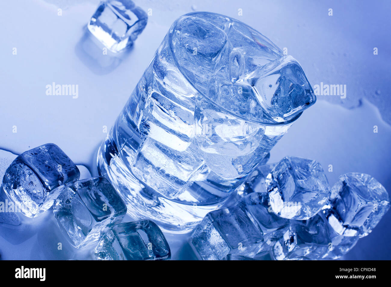 ice cubes in blue background Stock Photo - Alamy