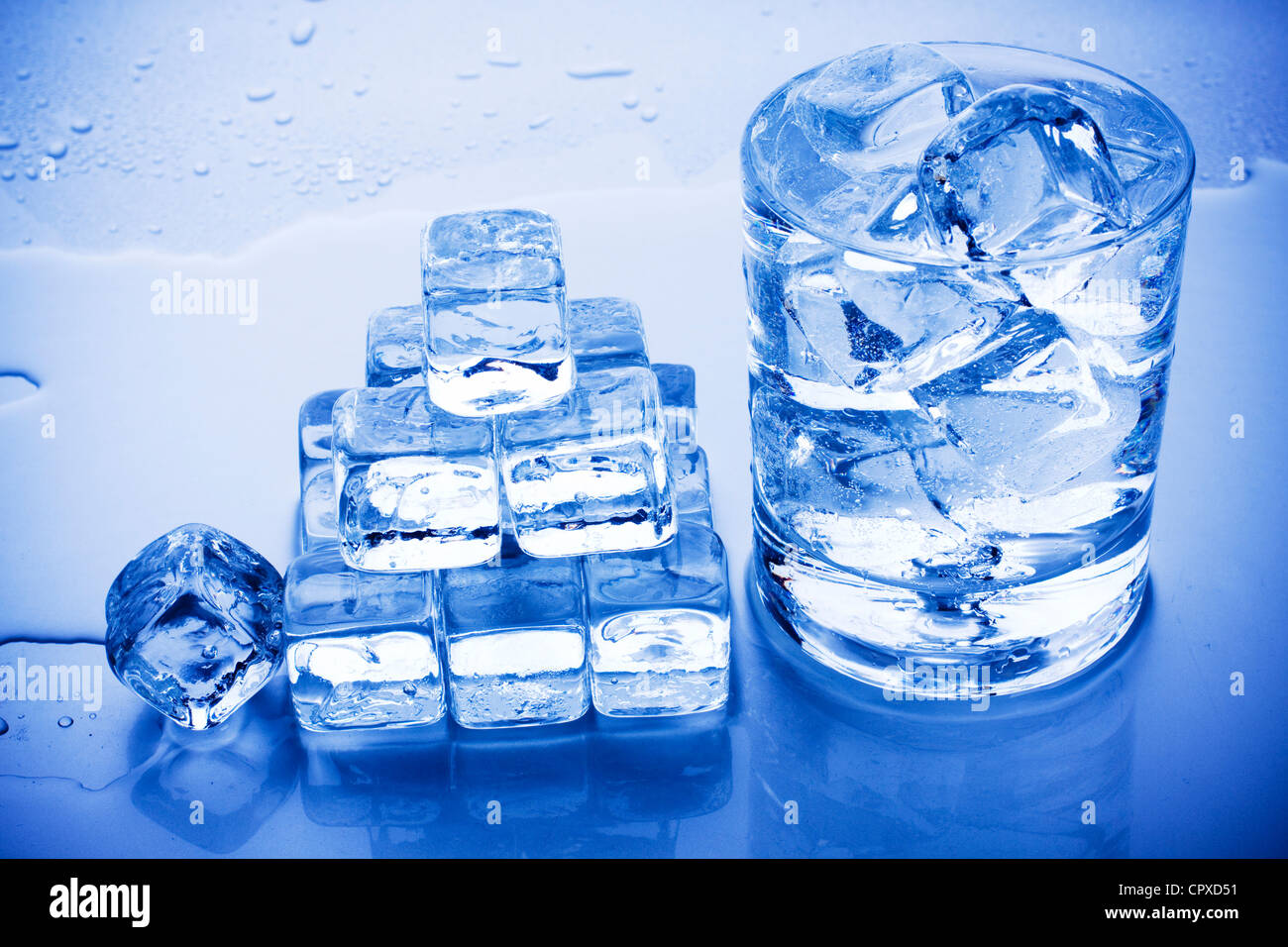 ice cubes in blue background Stock Photo - Alamy