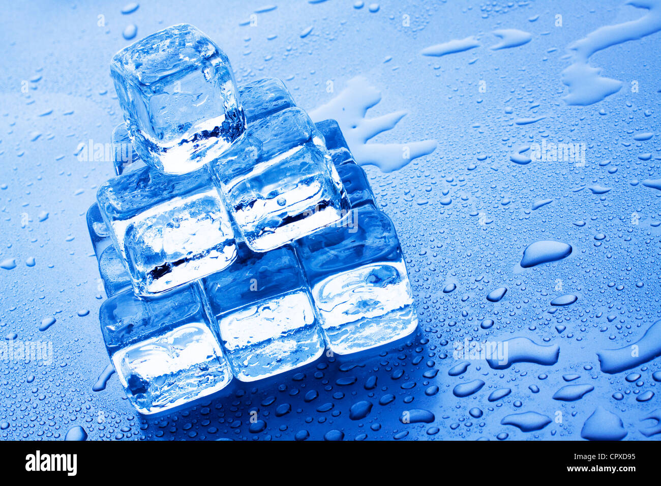 ice cubes in blue background Stock Photo - Alamy