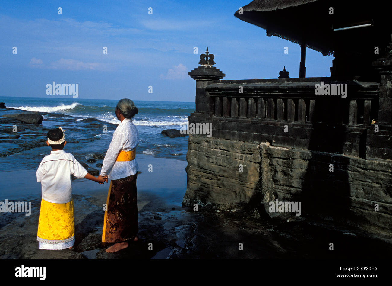 Indonesia, Bali, family at the Purah Tanah Lot Temple, purification ...