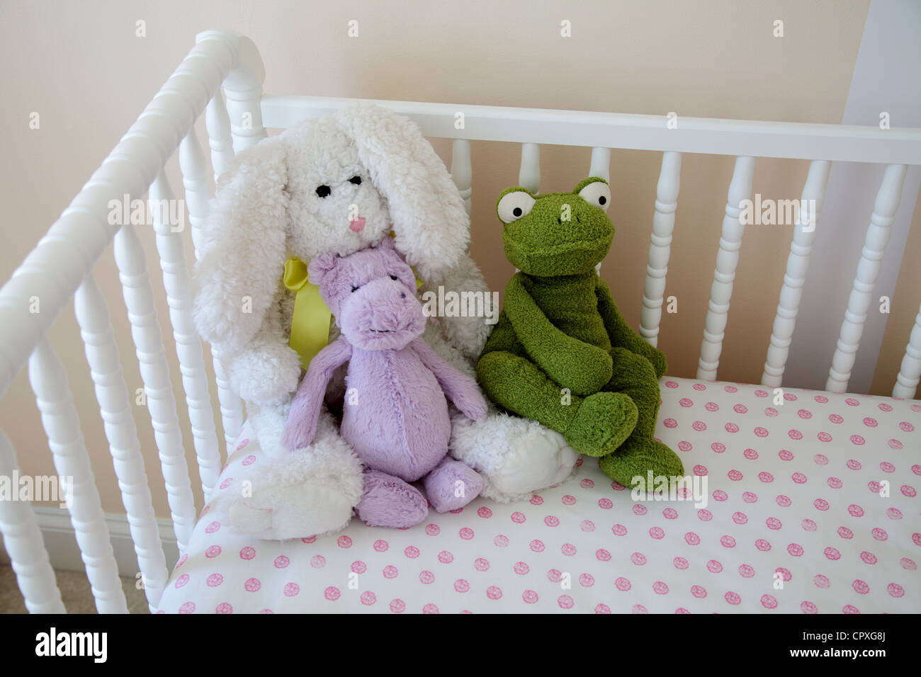 Stuffed animals in the crib Stock Photo - Alamy