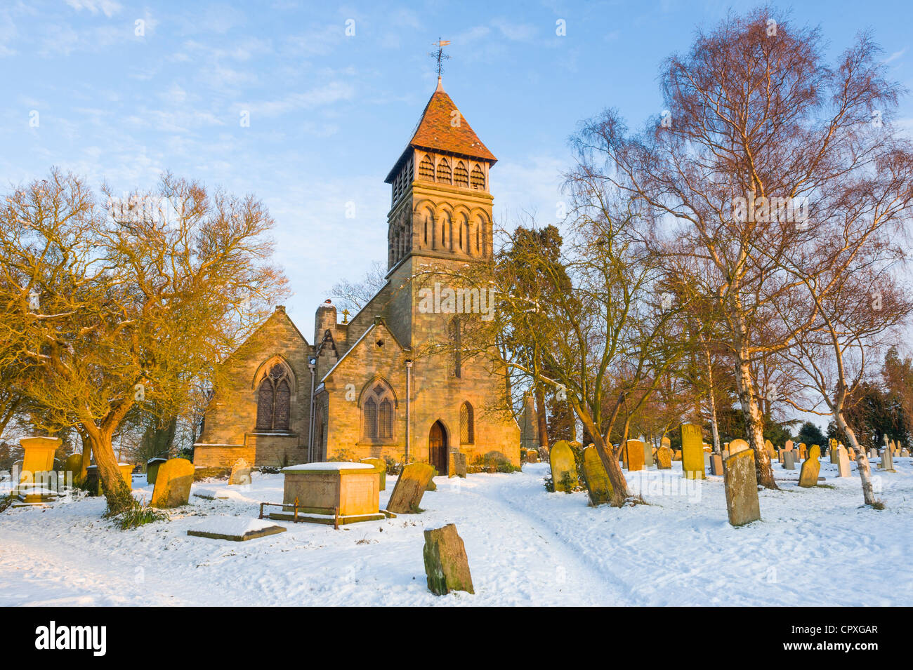 A snow covered winter sunset at the Old Milverton church, Old Milverton ...