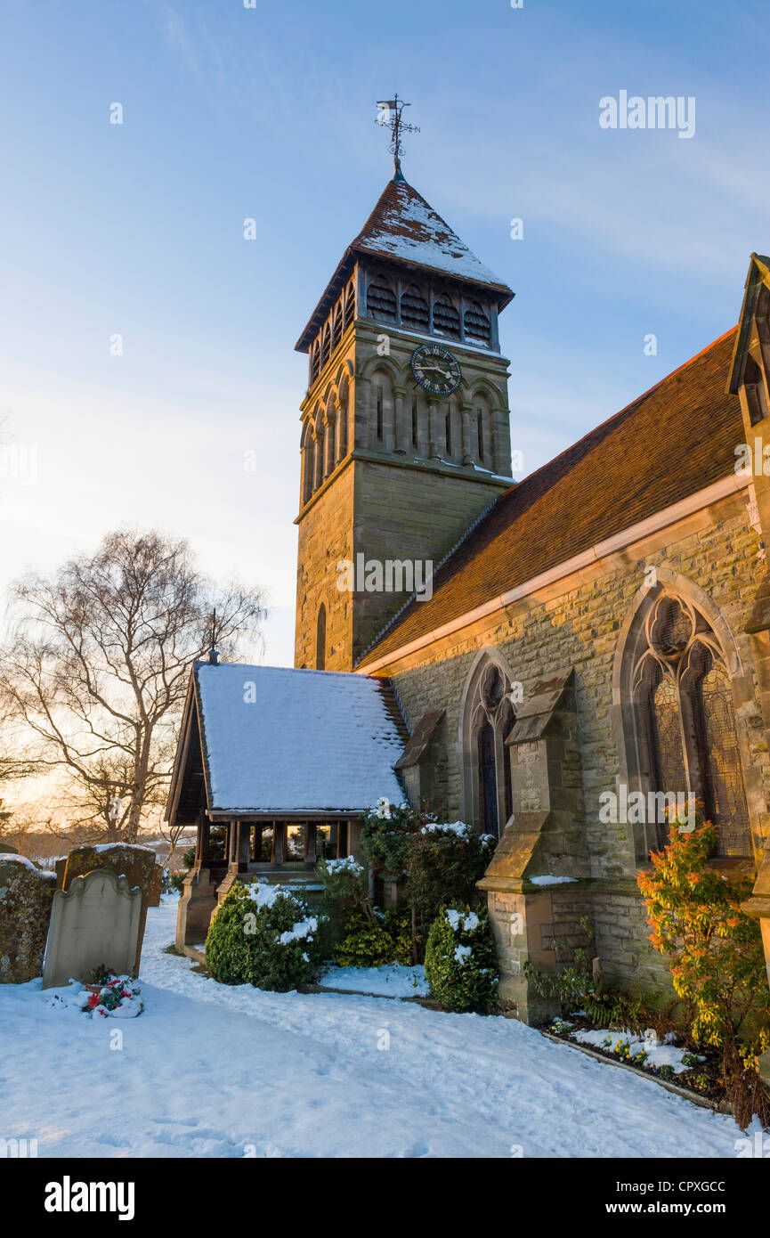 A snow covered winter sunset at the Old Milverton church, Old Milverton ...