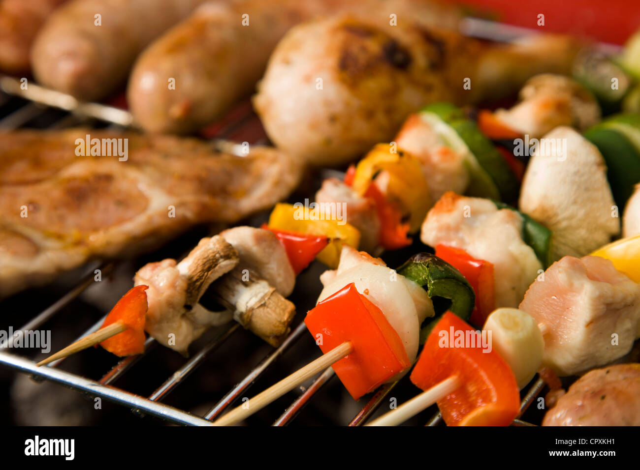 Closeup of fried meat on grill Stock Photo - Alamy