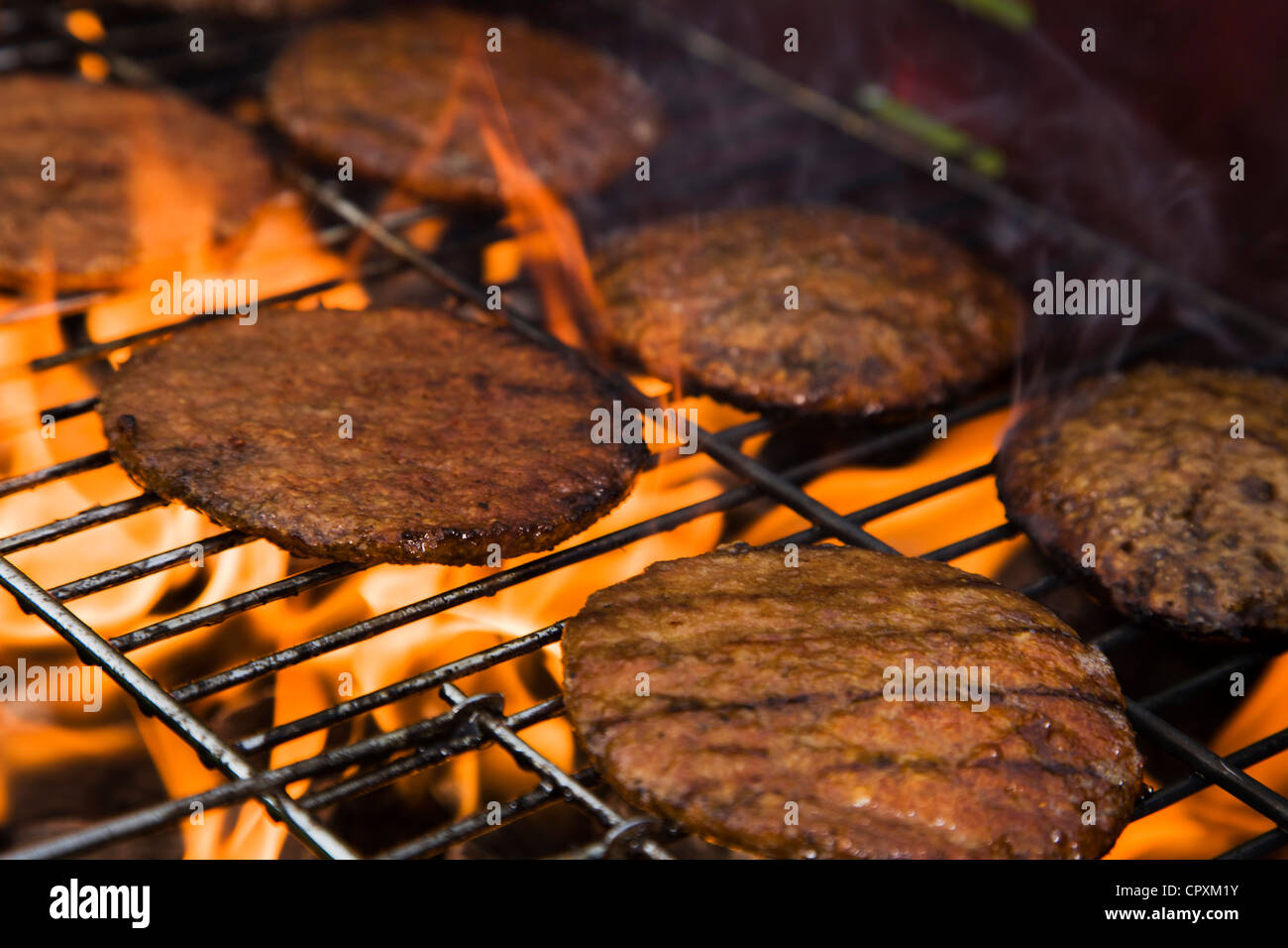 Closeup of fried meat on grill Stock Photo - Alamy