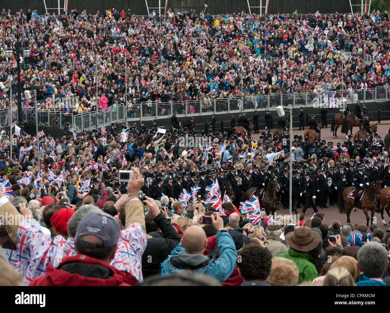 A police cordon control the entry of the crowd entering the area around ...