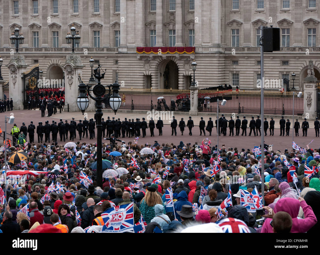 A police cordon control the entry of the crowd entering the area around ...