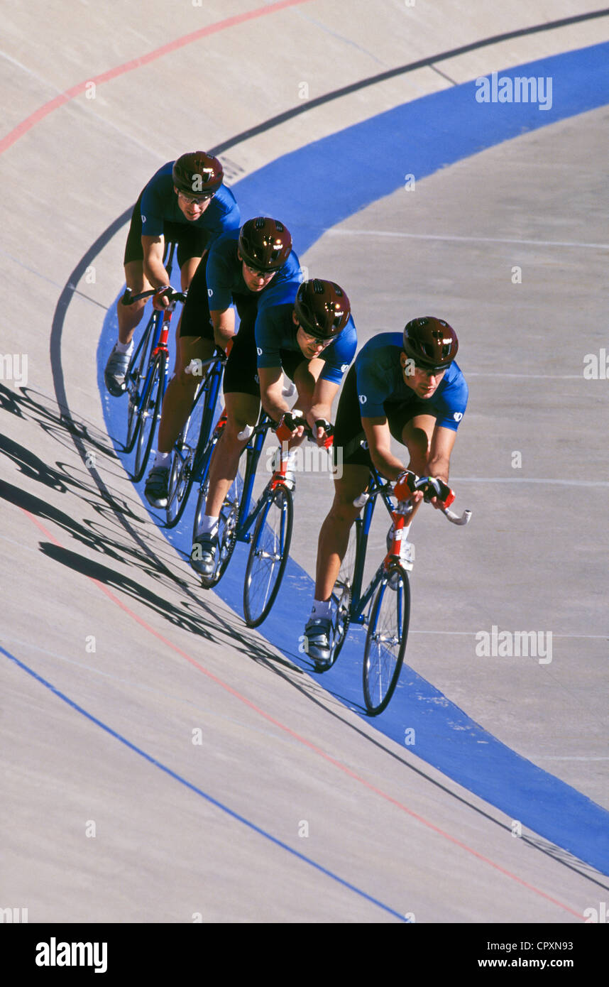 Male cycling team racing on the velodrome track Stock Photo - Alamy