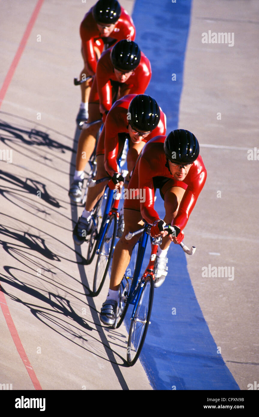 Male cycling team racing on the velodrome track Stock Photo - Alamy