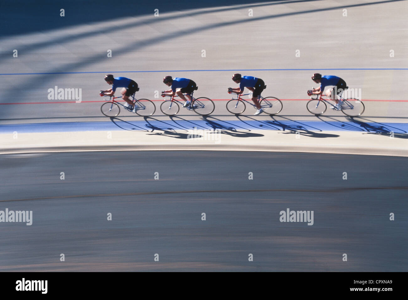 Male cycling team racing on the velodrome track Stock Photo - Alamy