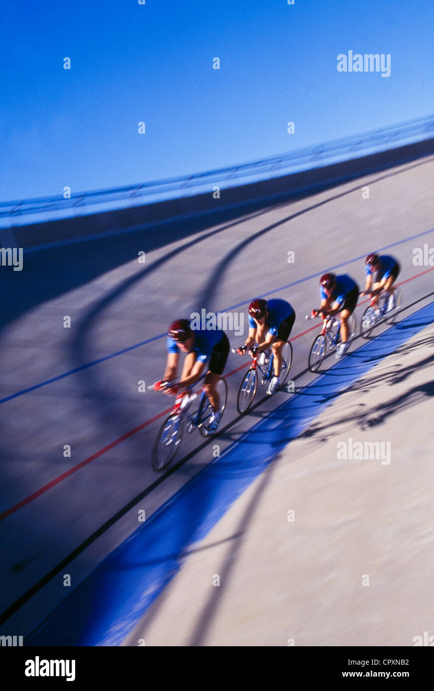 Male cycling team racing on the velodrome track Stock Photo - Alamy