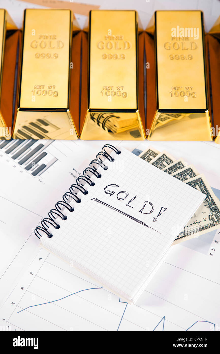Gold bars on graphs and statistics Stock Photo - Alamy