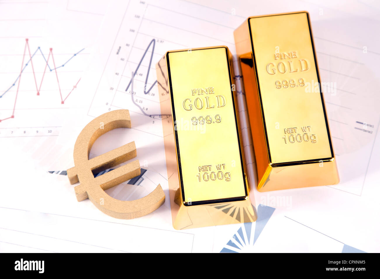 Gold bars on graphs and statistics Stock Photo - Alamy