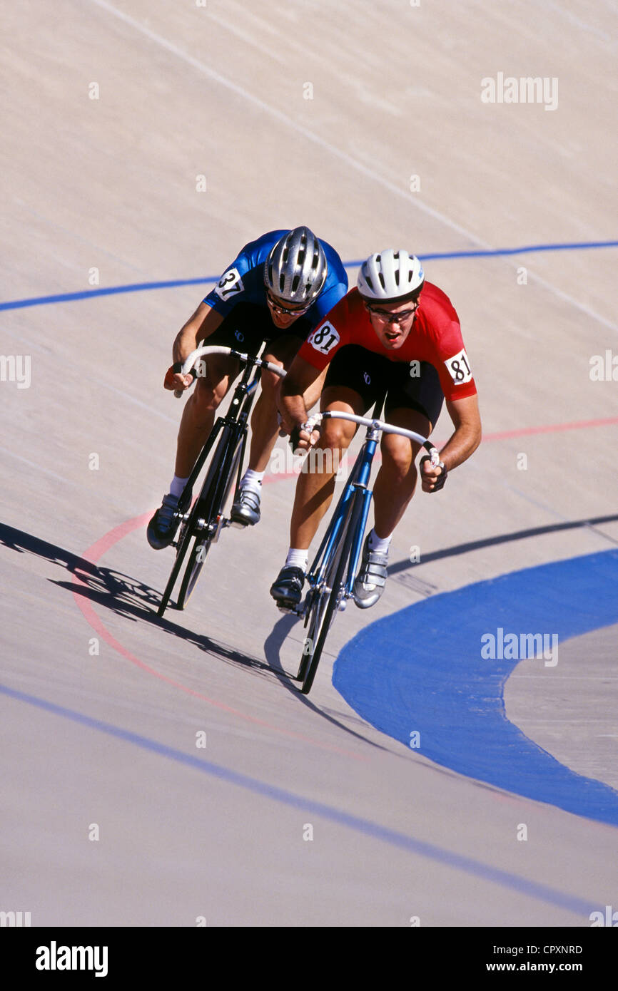 Male cyclists racing on the velodrome track Stock Photo - Alamy